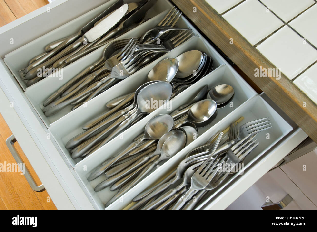 opened kitchen drawer showing cutlery Stock Photo - Alamy