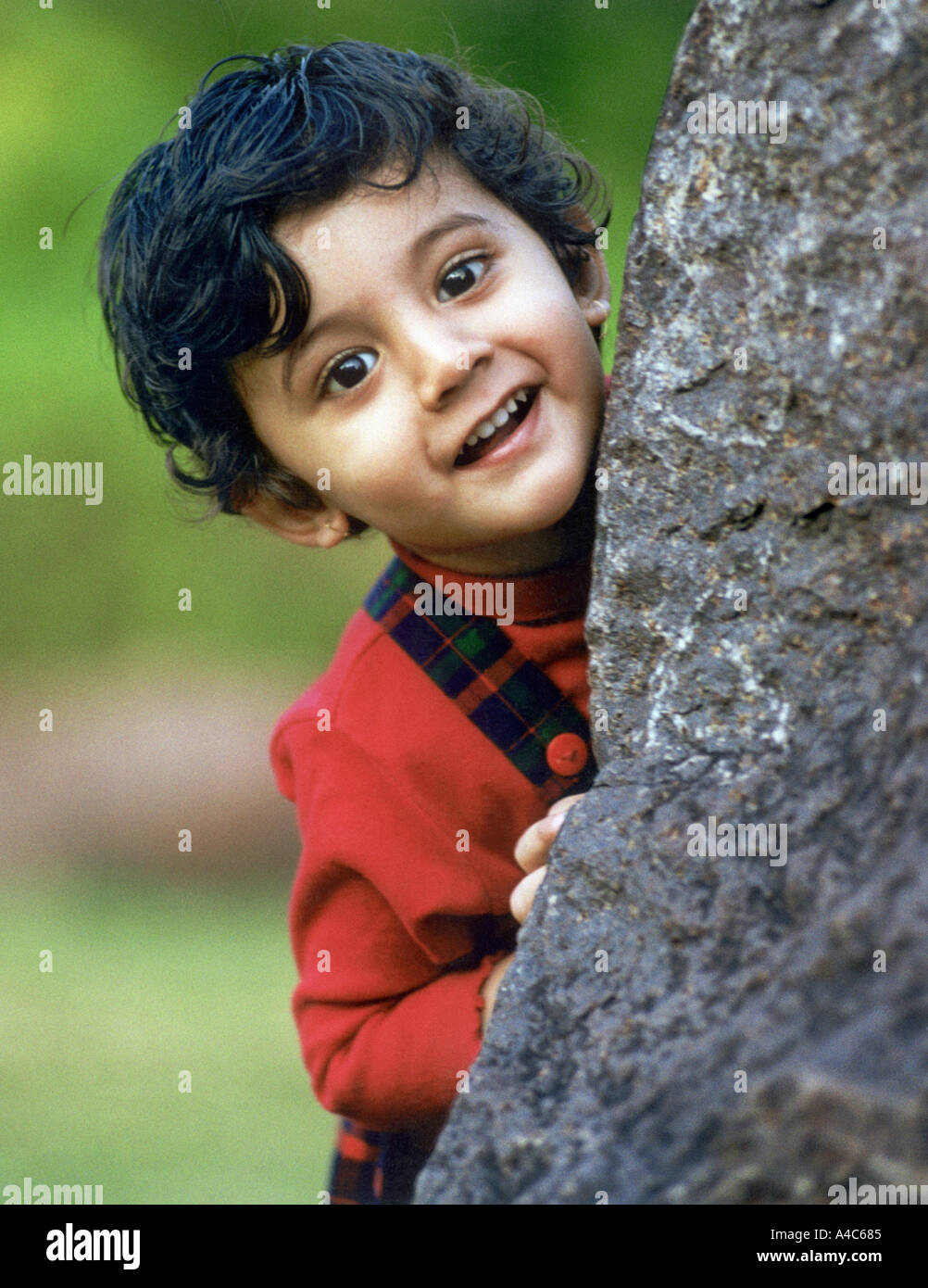 Children standing under a tree hi-res stock photography and images - Alamy