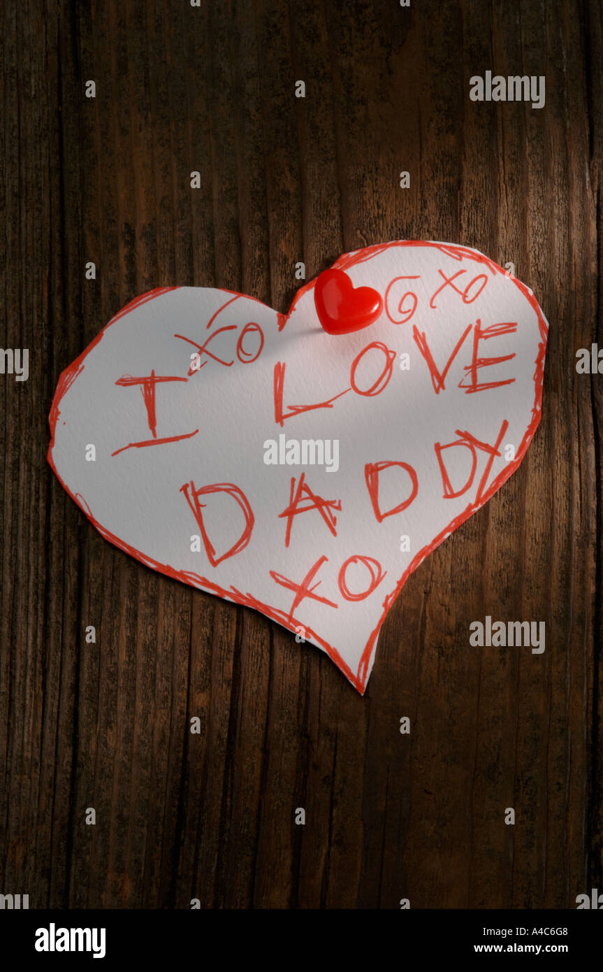 love note to daddy cut out in a paper heart shape by a child and pinned ...
