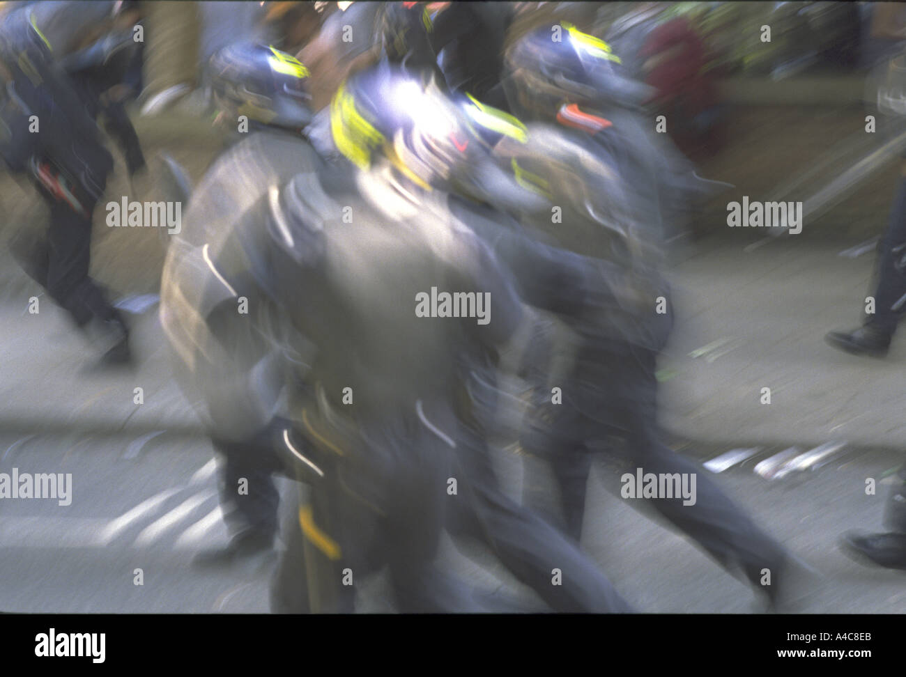 riot police running after demonstrators during disturbances in London ...
