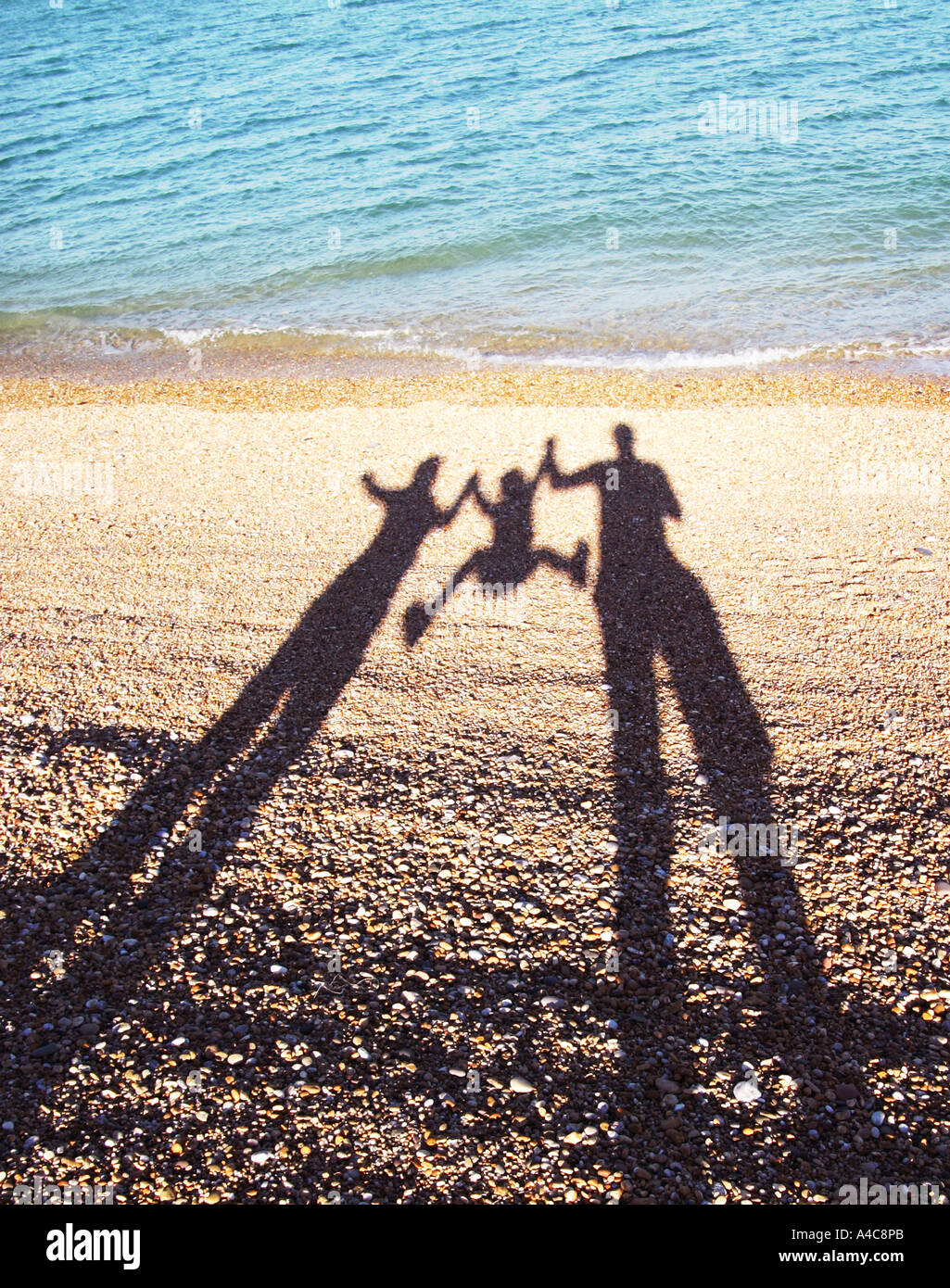 Family shadow beach hi-res stock photography and images - Alamy