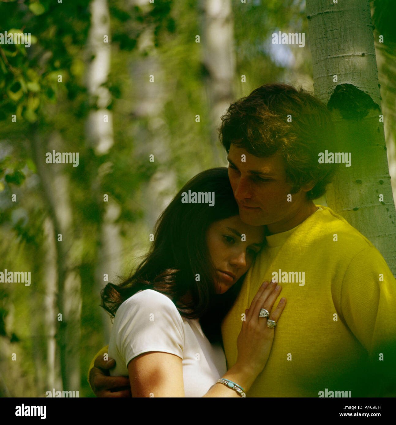 Romantic couple enjoy closeness in a woodsy setting Stock Photo - Alamy