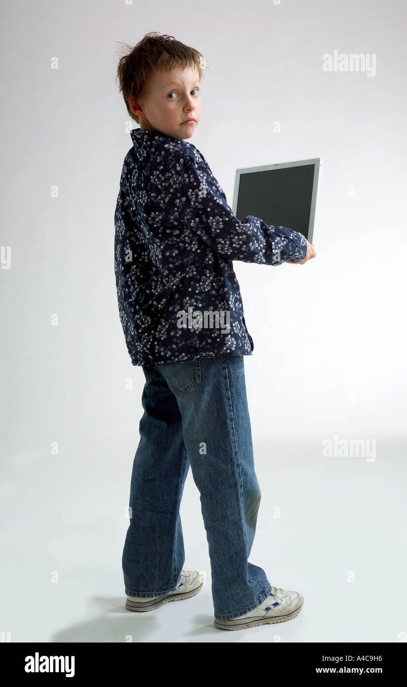 Surprised boy looking over shoulder hi-res stock photography and images ...