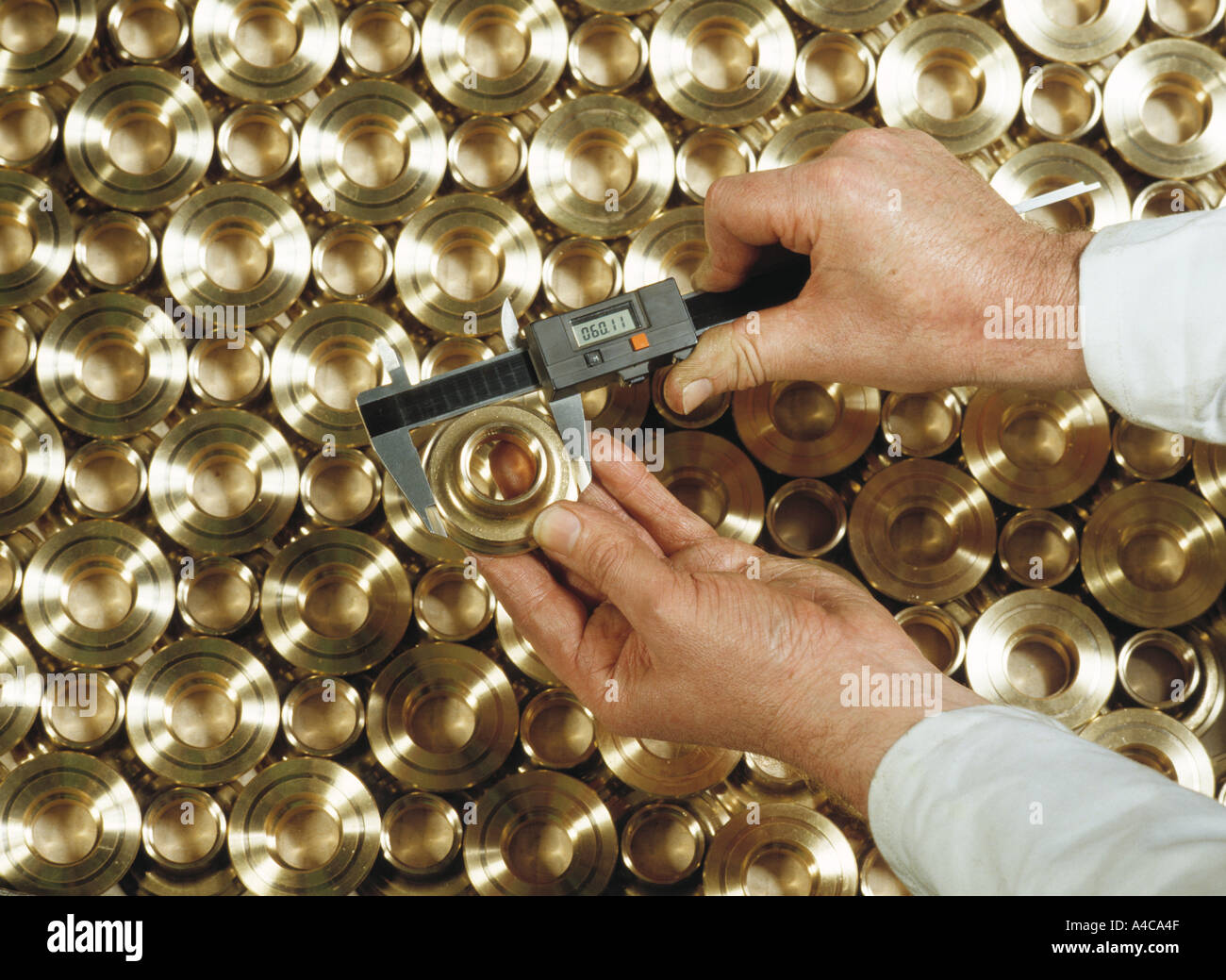 CHECKING MEASUREMENT OF METAL PARTS USING MICROMETER SCREW GAUGE Stock ...