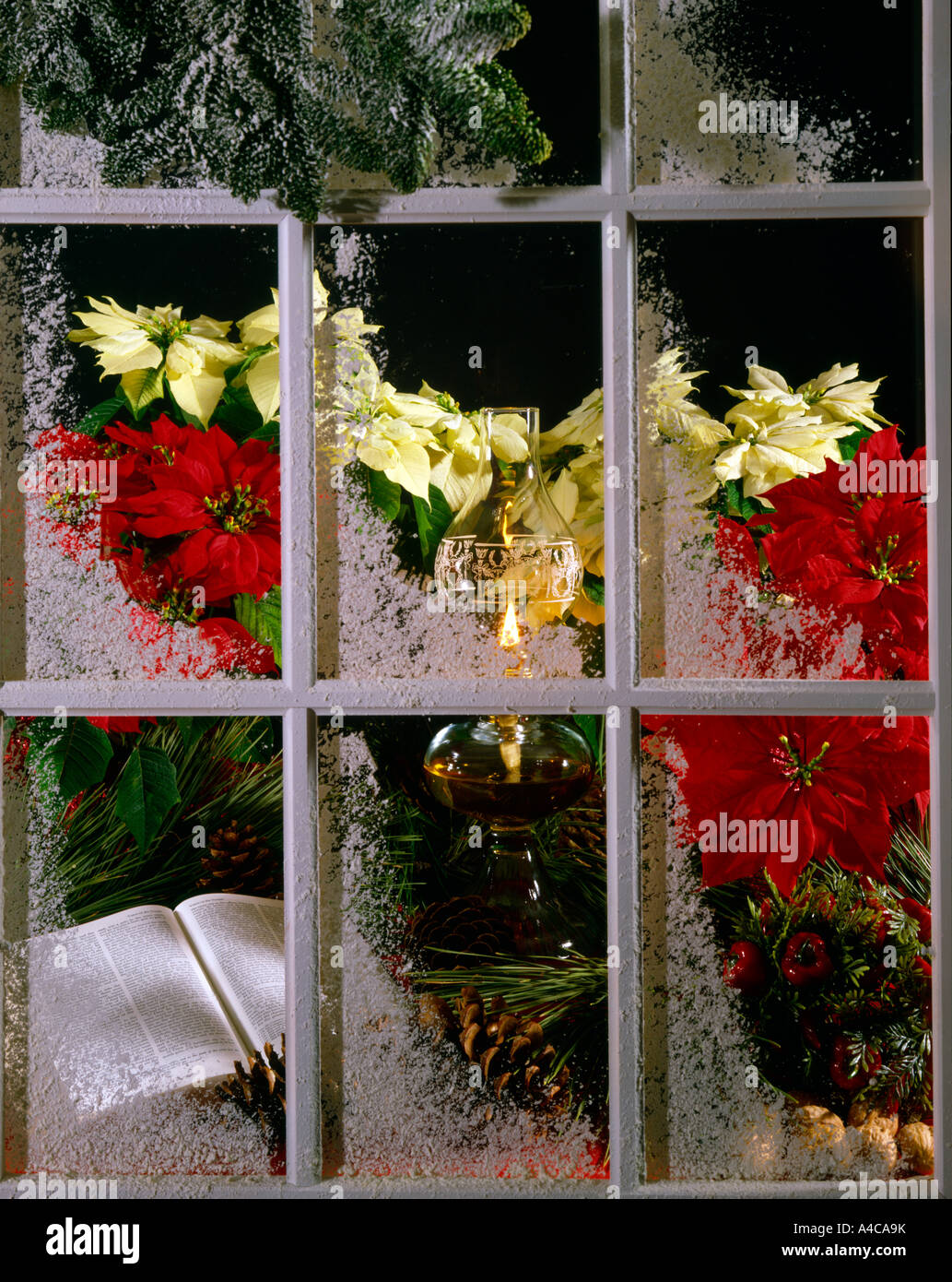 Frost covered window looking into a scene of Christmas decor Stock ...