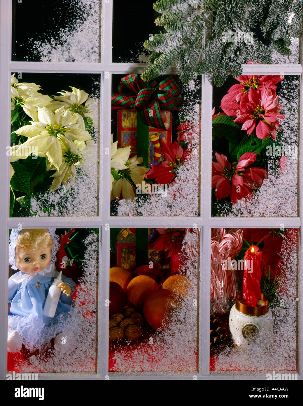Frosty window look into Christmas festive decor Stock Photo - Alamy