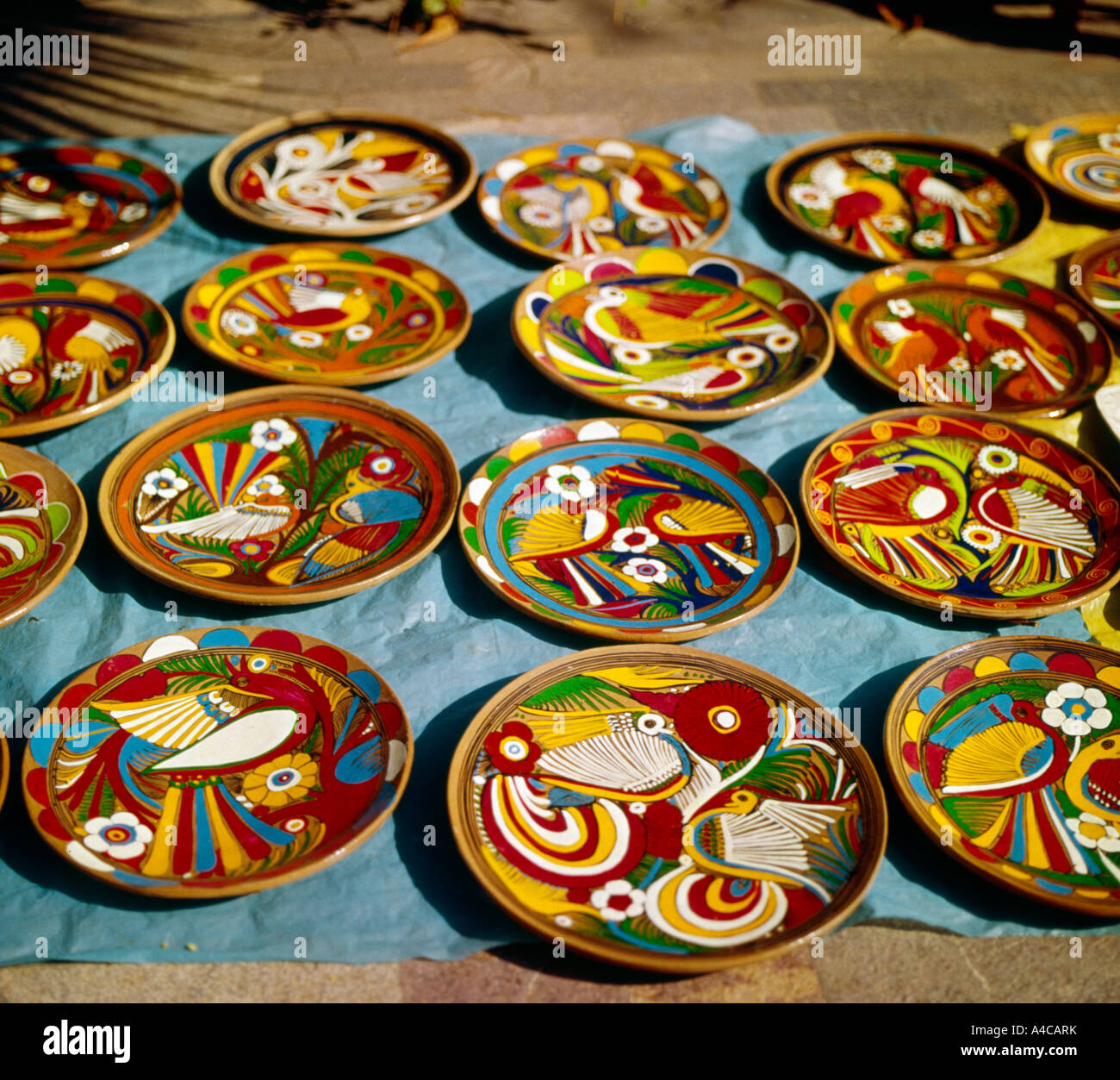 Display of colorful pottery plates for sale to tourists in the resort ...