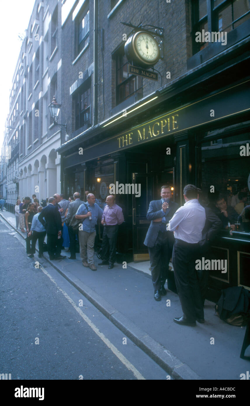 Drinkers outside the Magpie pub The city of London UK Stock Photo - Alamy
