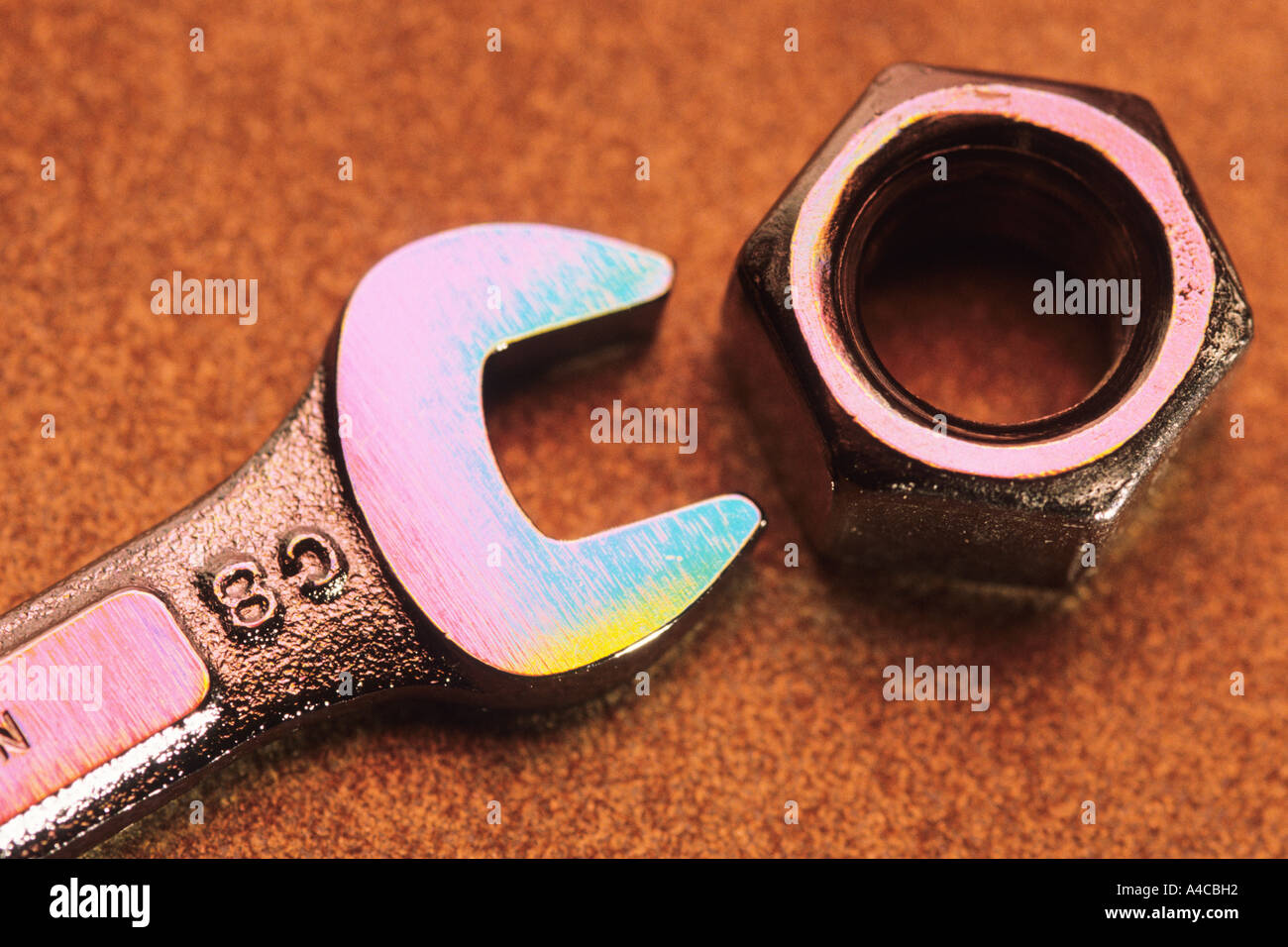 Small wrench large nut Stock Photo - Alamy