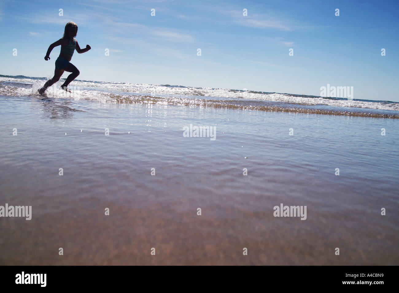 Girl running through the sea hi-res stock photography and images - Alamy