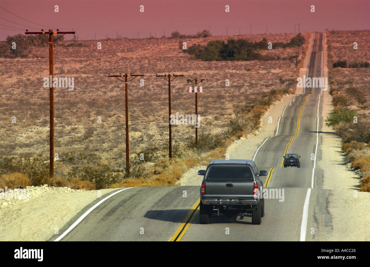 car on desert road in California Stock Photo - Alamy