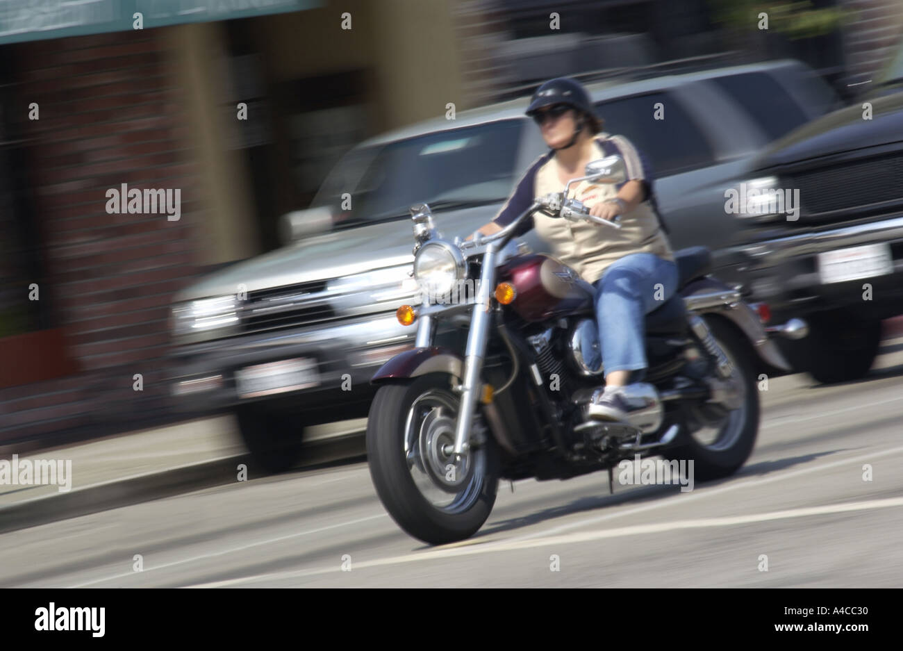 motorcycle in city traffic Stock Photo - Alamy