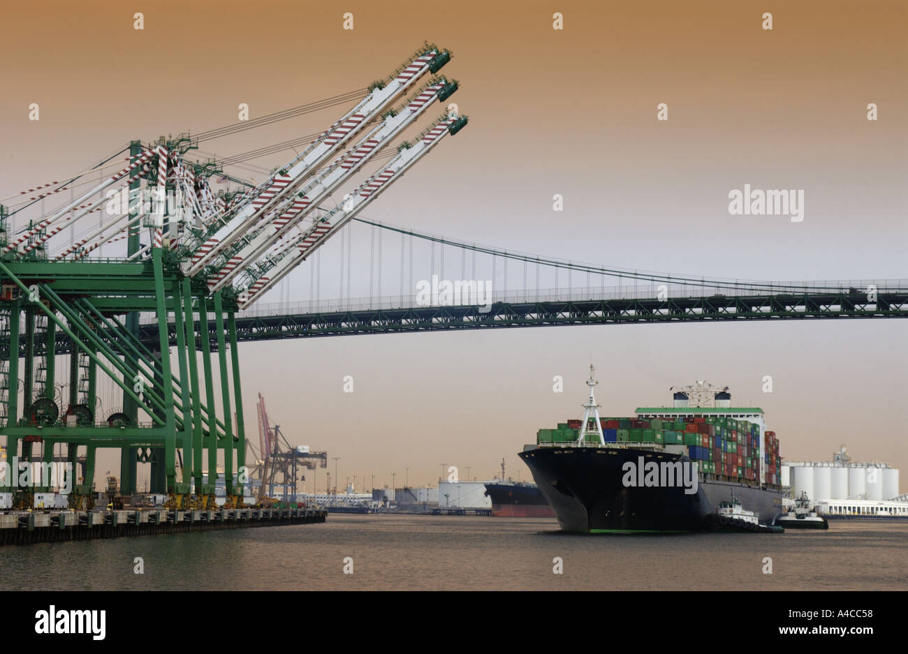 container ship passing under suspension bridge Stock Photo - Alamy