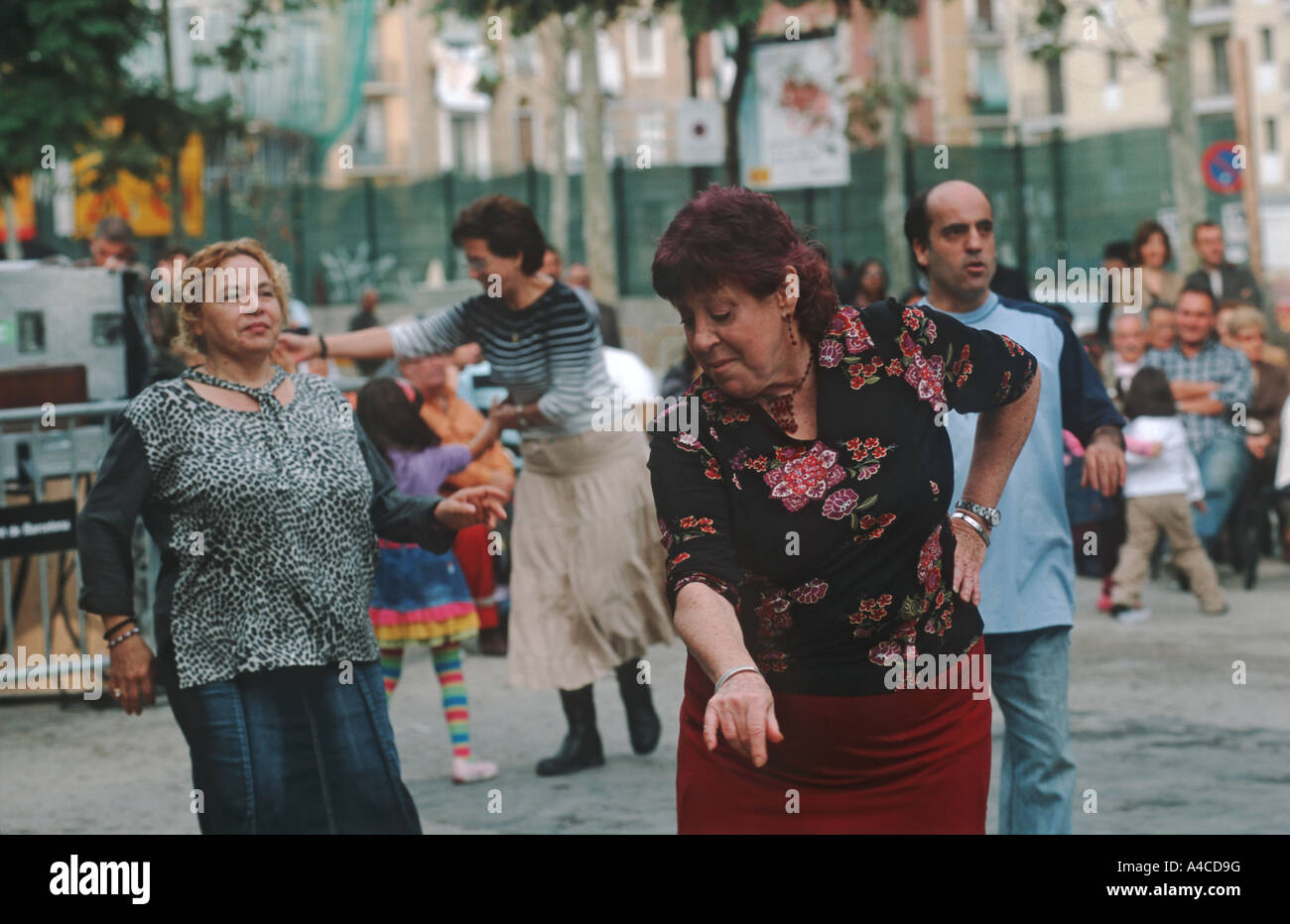 Two older women dancing outdoors to live music, Barcelona Stock Photo ...