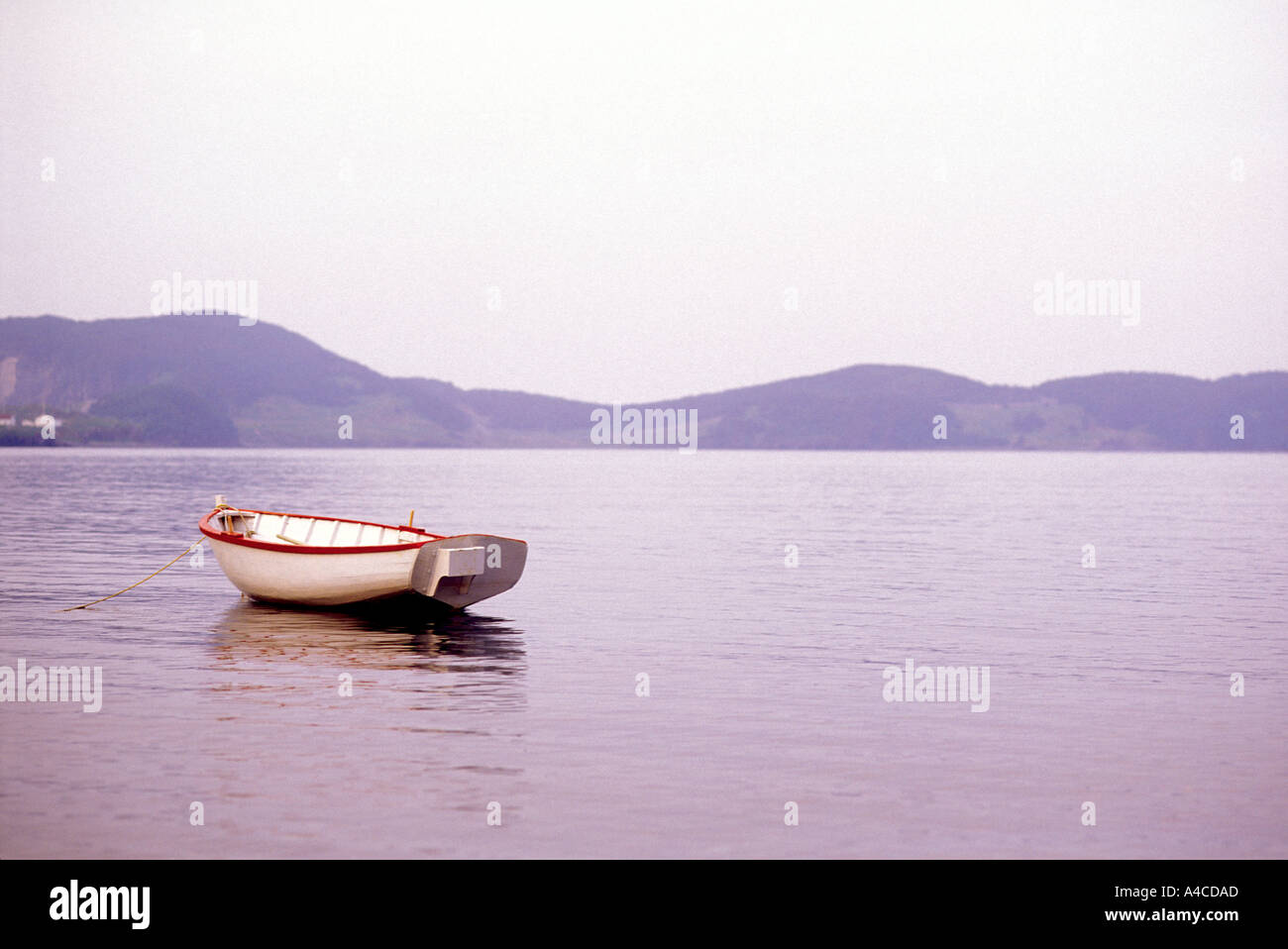 Small boat at anchor near the town of Trinity in Newfoundland Canada ...