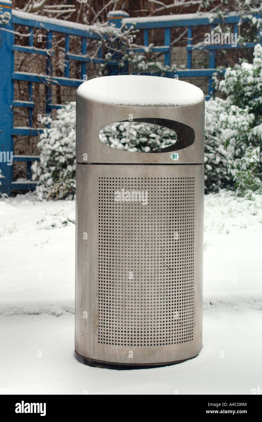 Modern Designed Metal Waste Bin.Standing In A Snow Covered Environment ...