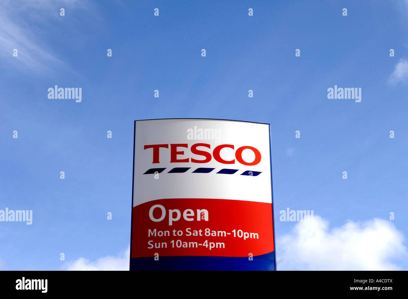 A generic Tesco supermarket sign against a blue sky Stock Photo - Alamy