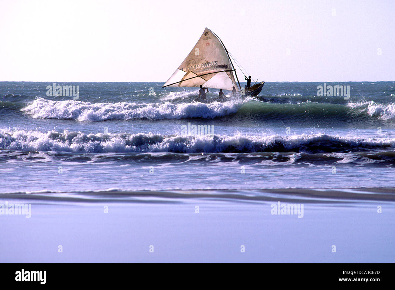 Sail boat crossing the waves Brazil Stock Photo - Alamy