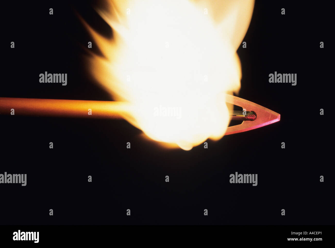 Arrow tip with flame Stock Photo - Alamy