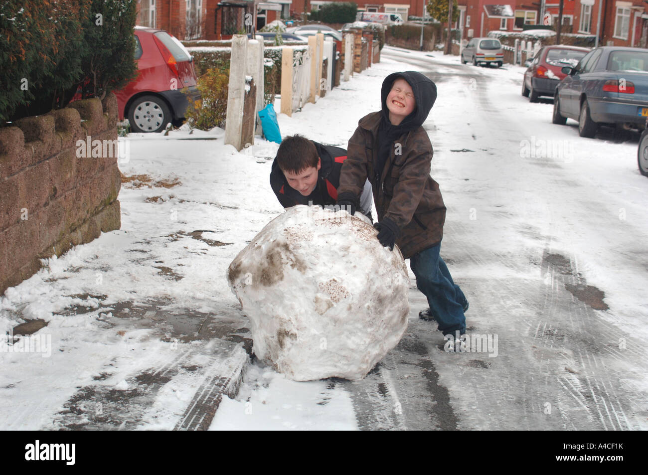 Rolling A Big Snowball High Resolution Stock Photography and Images - Alamy