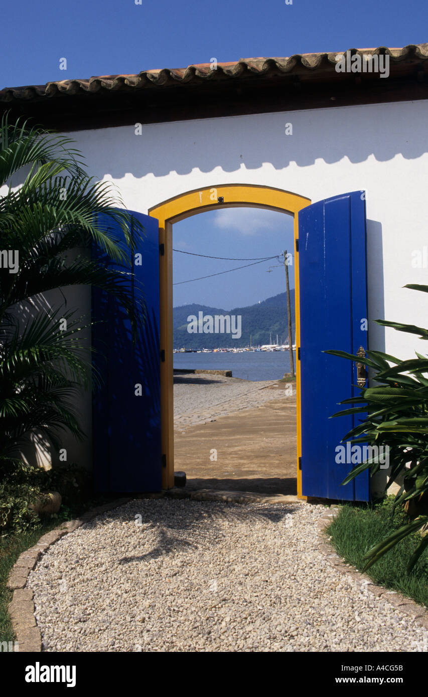 Paraty, Rio de Janeiro, Brazil. View through blue gates to the sea ...