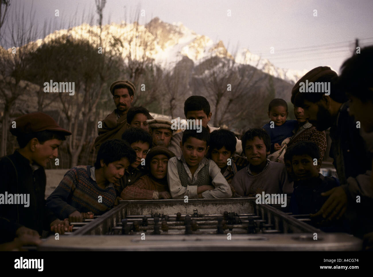 children playing table football pakistan Stock Photo - Alamy