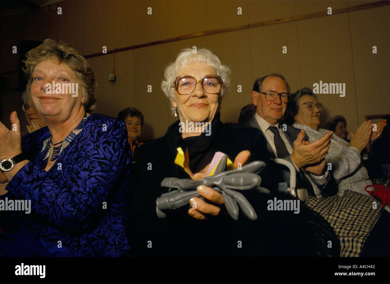 old people clapping hands at book launch dinner Stock Photo - Alamy
