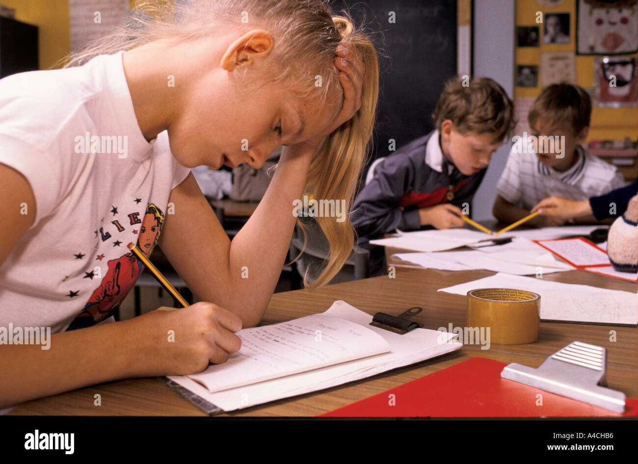PRIMARY CLASSROOM, YOUNG GIRL WRITING Stock Photo - Alamy