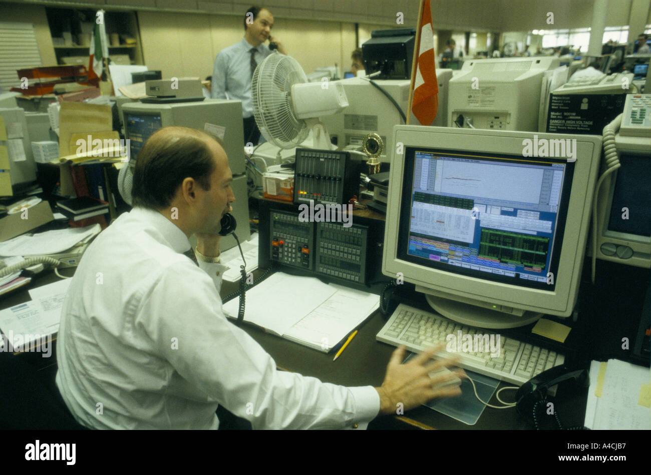 trading floor london 1994 a broker talks on telephone in front of ...