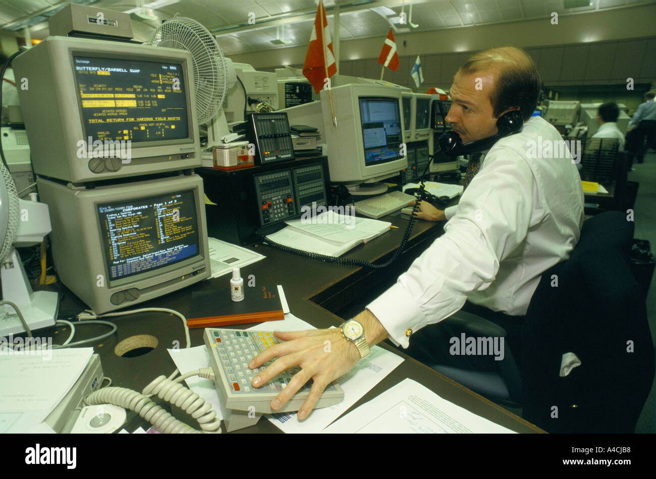trading floor london 1994 a broker talks on telephone while works on ...