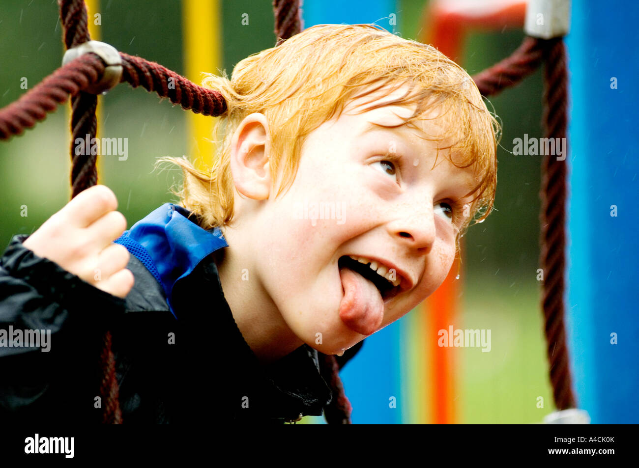 Playing in the rain hi-res stock photography and images - Alamy