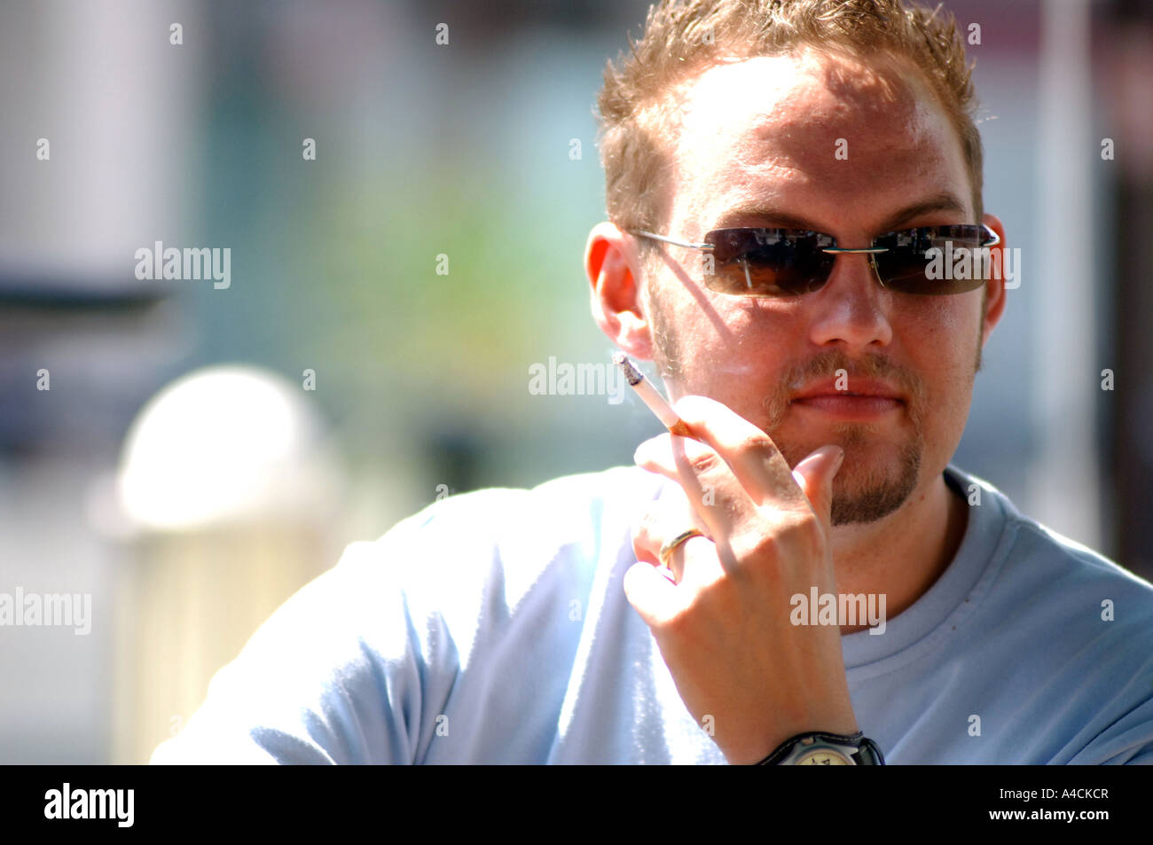 Royalty free photograph of British college university student smoking ...