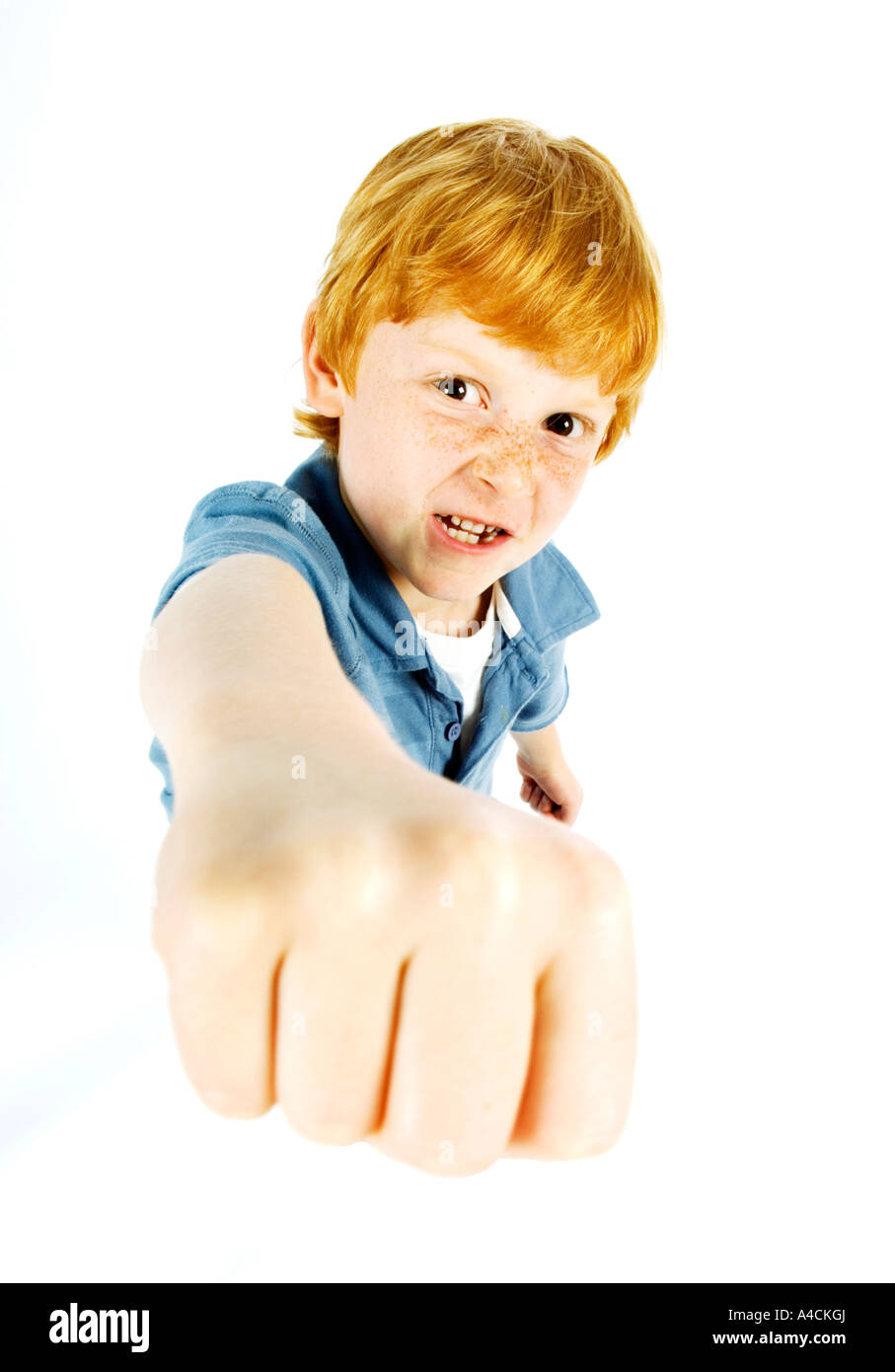 Young boy punching forward in to the air Stock Photo - Alamy