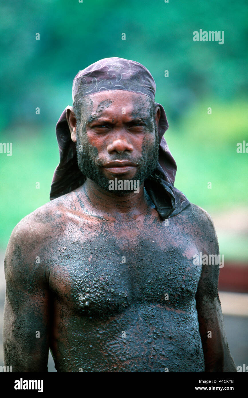 Young man covered in mud hi-res stock photography and images - Alamy
