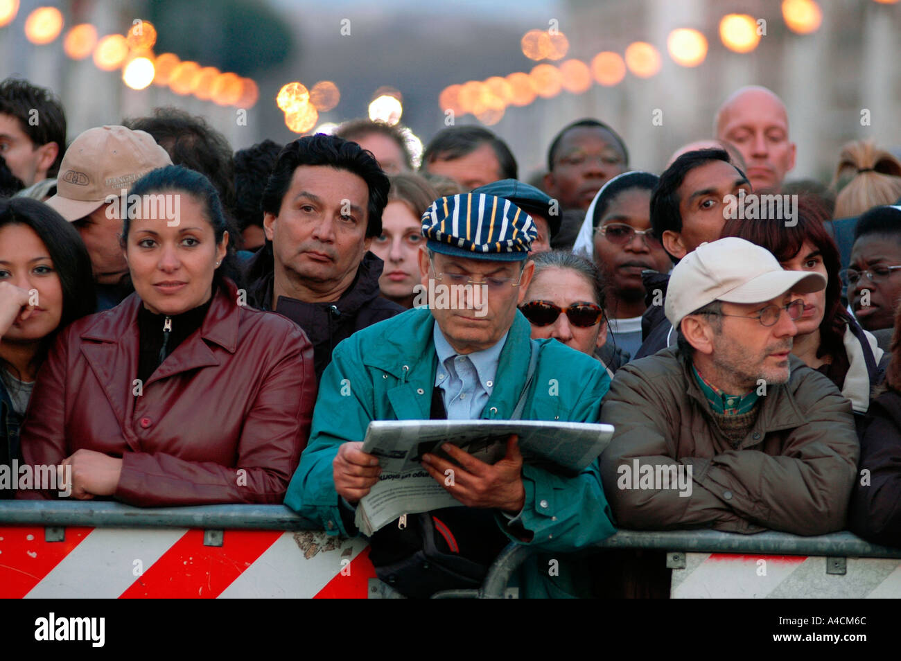 man reading a newspaper while wait to see pope s body st peters sq Pope ...