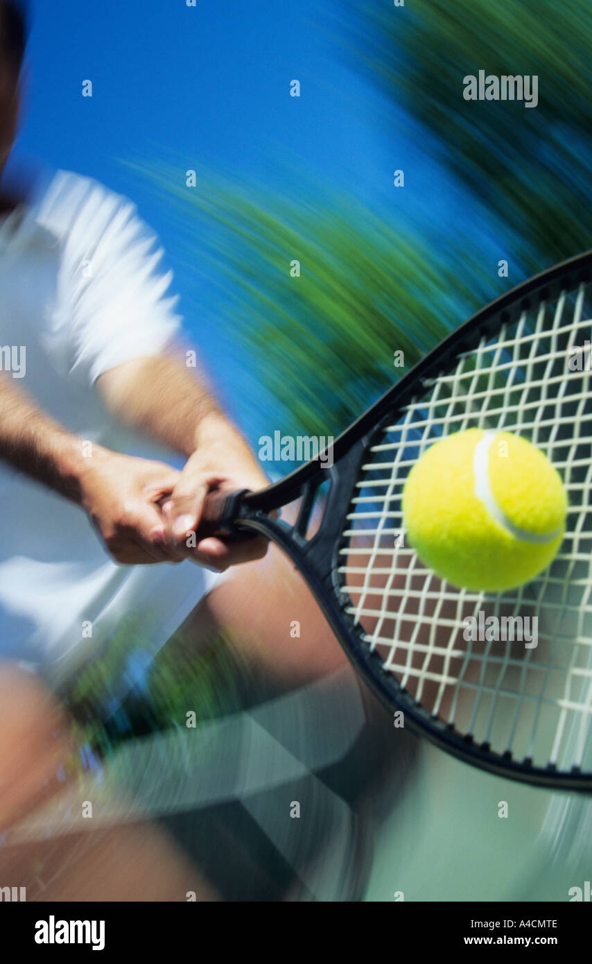 Tennis player returning ball Stock Photo - Alamy