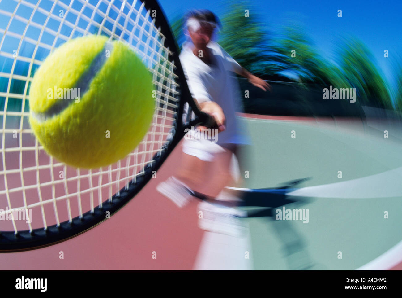 Tennis player returning ball Stock Photo - Alamy