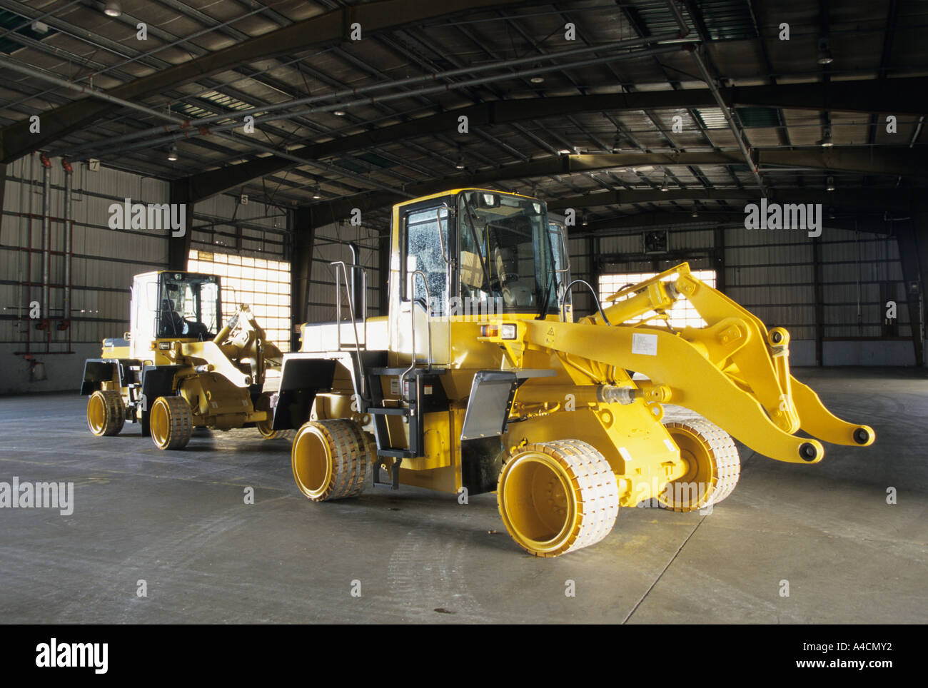 New tractors in warehouse being prepared for shipping Stock Photo - Alamy