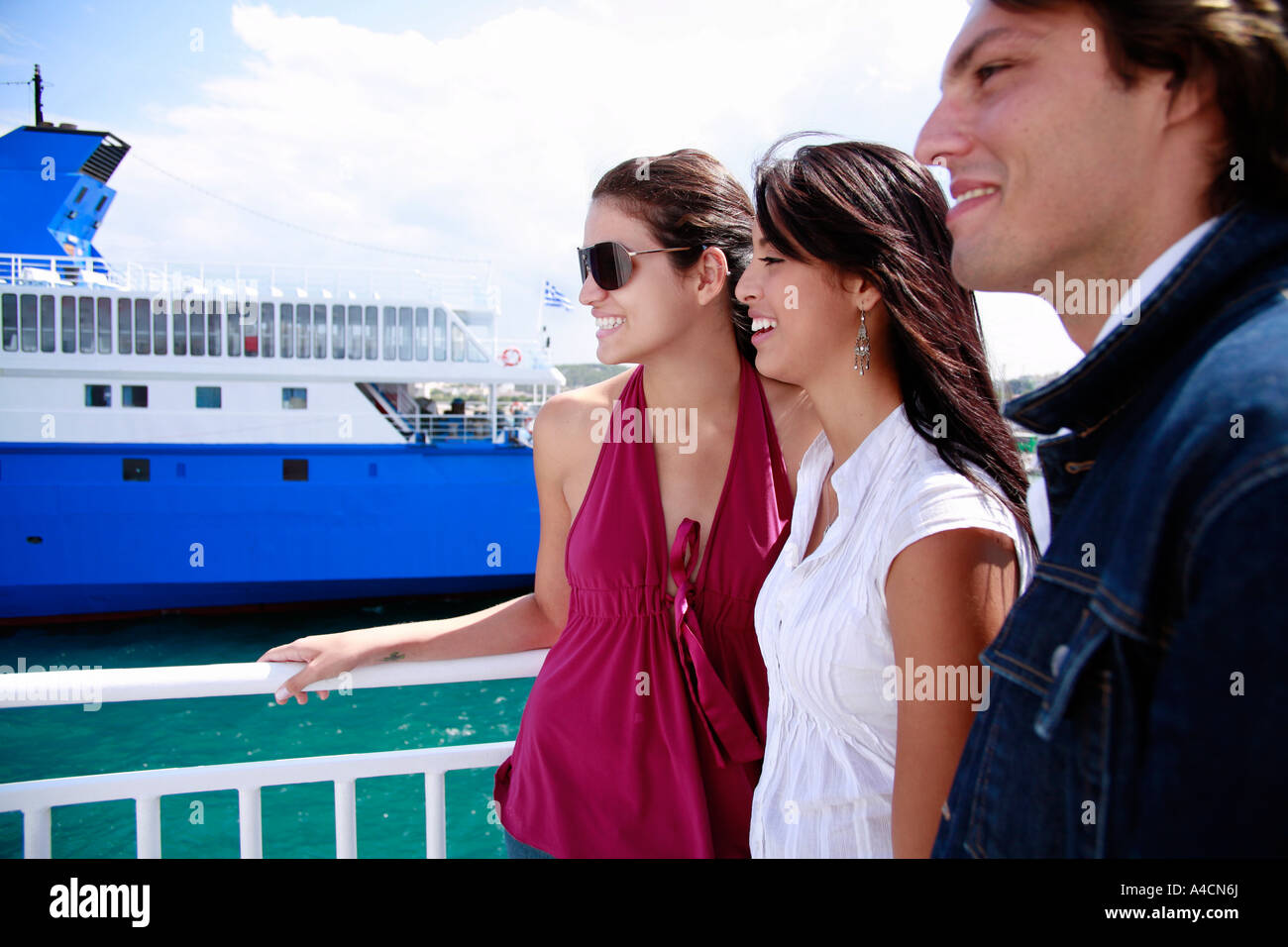 Young people at ferry dock Stock Photo - Alamy