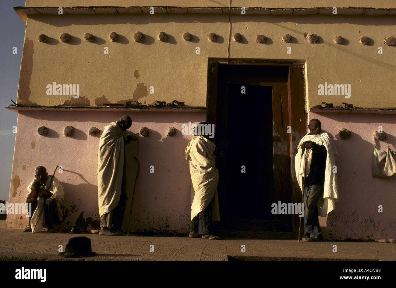Africa man village crouching hi-res stock photography and images - Alamy
