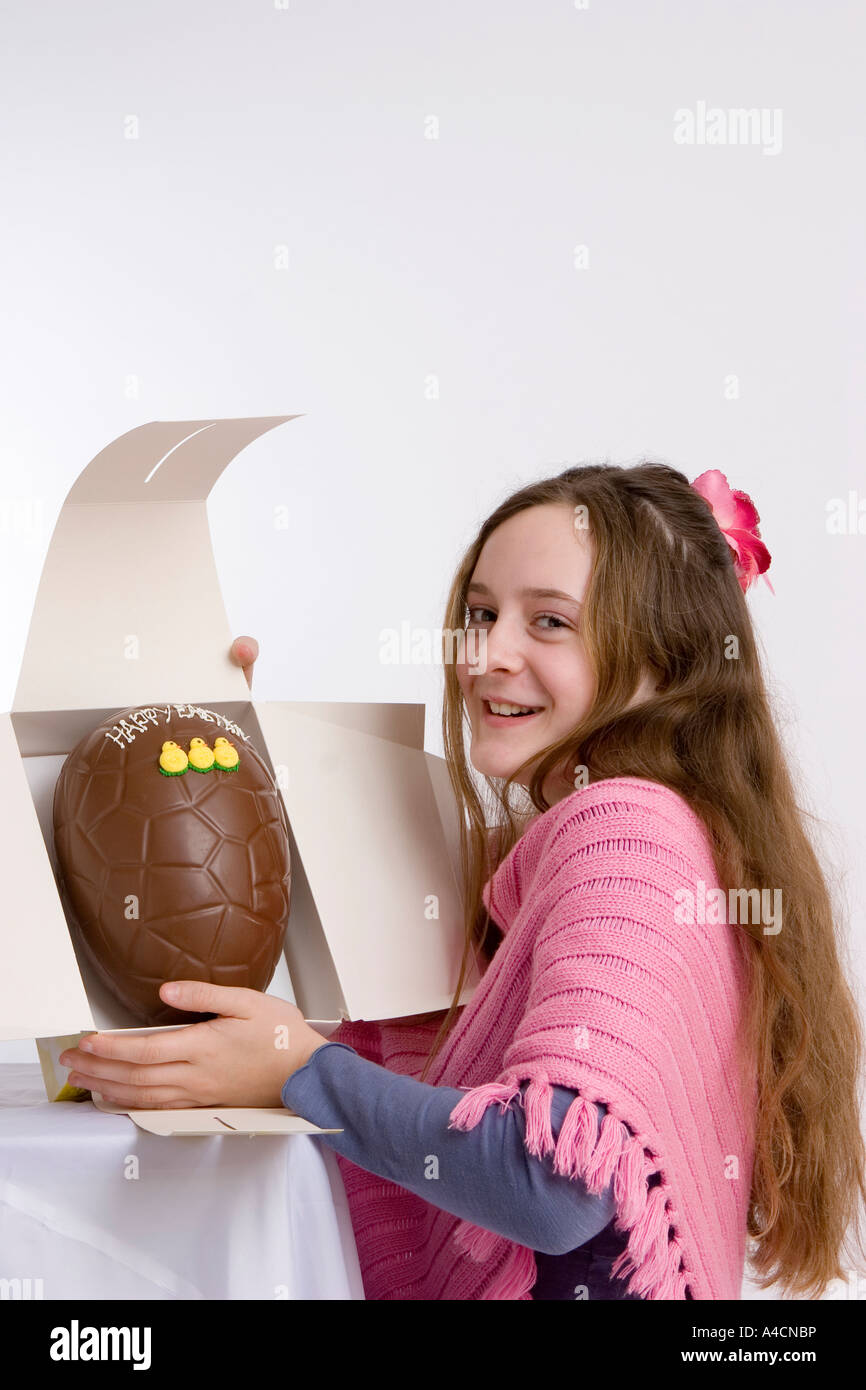 Happy youngster with her chocolate Easter egg Stock Photo - Alamy