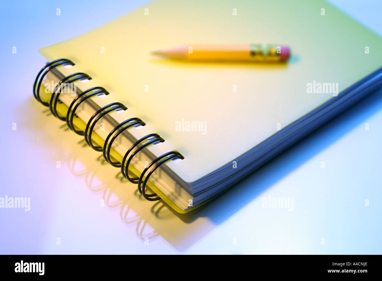 Short Pencil on Note Book Stock Photo - Alamy