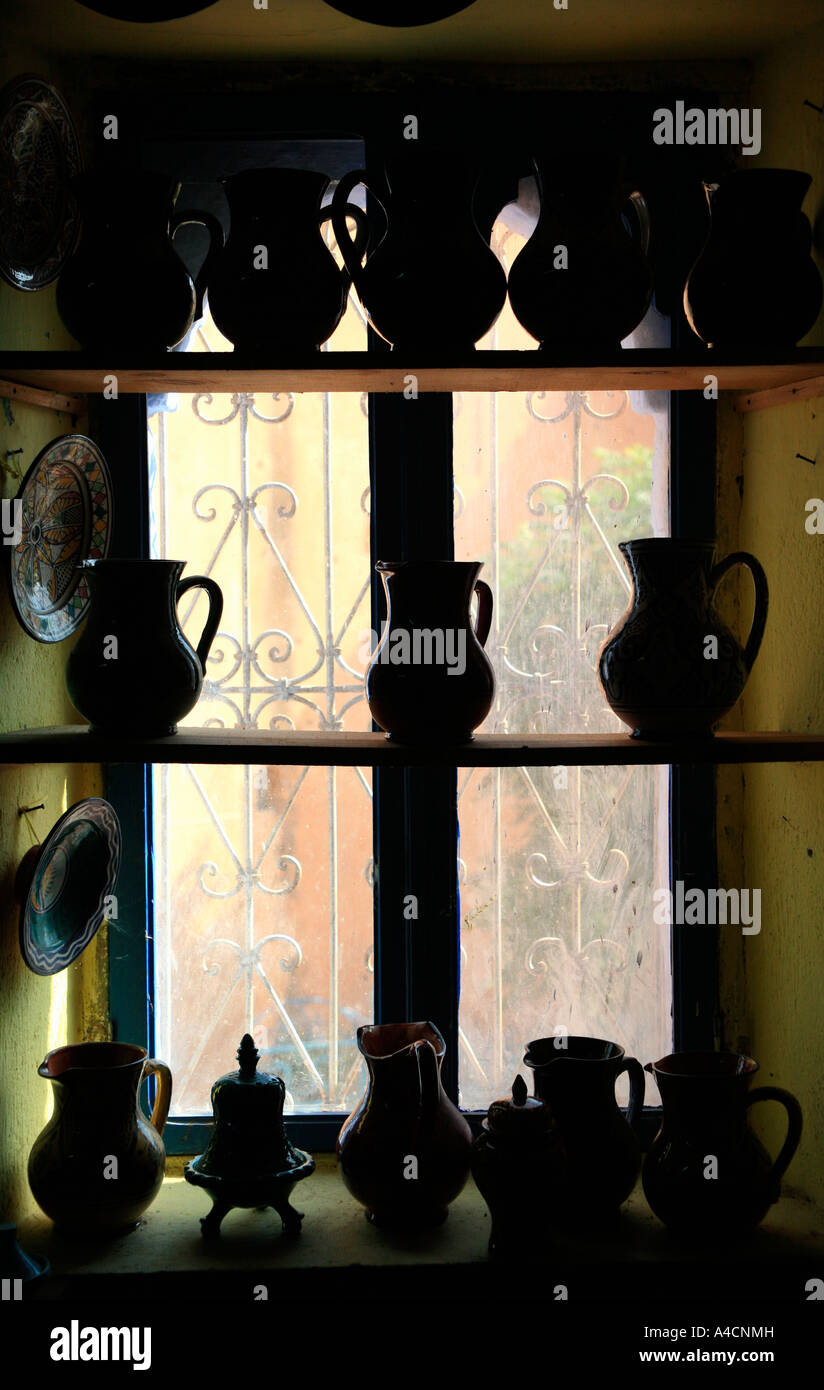 Pottery displayed in window Stock Photo - Alamy