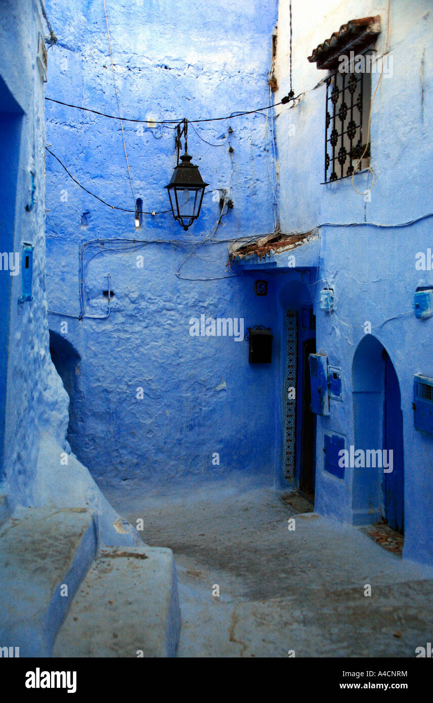 Blue alley with doorways Stock Photo - Alamy
