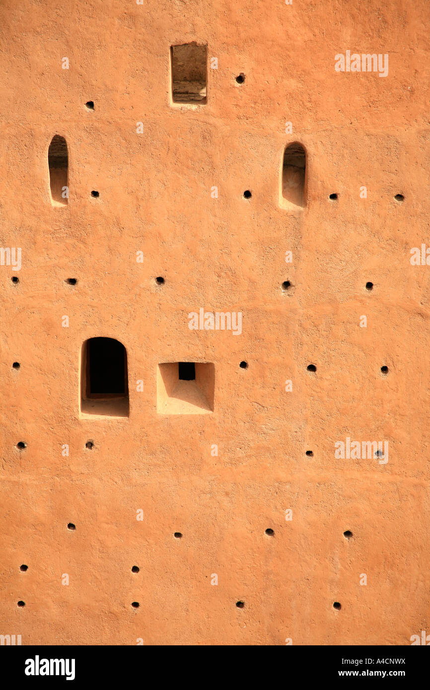 Closeup of building wall with holes Stock Photo - Alamy