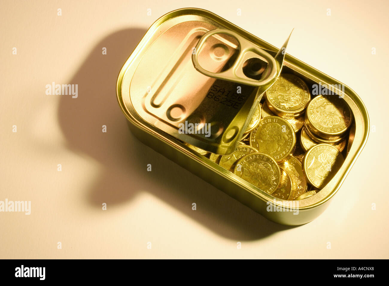 Coins in Tin Can Stock Photo - Alamy