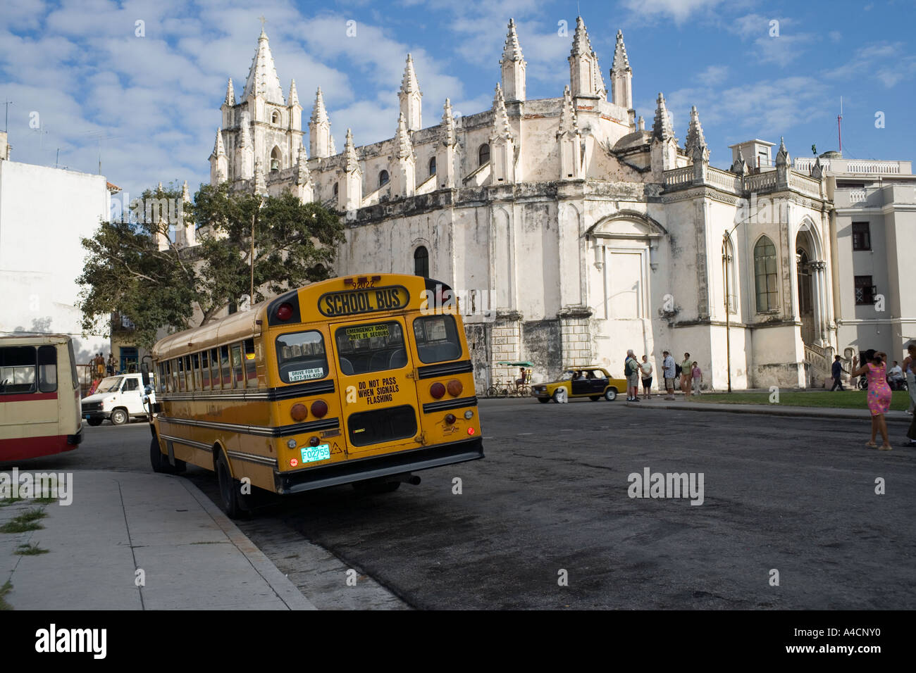 School bus with the church of Santo Angelo Custodio ,central Havana ...