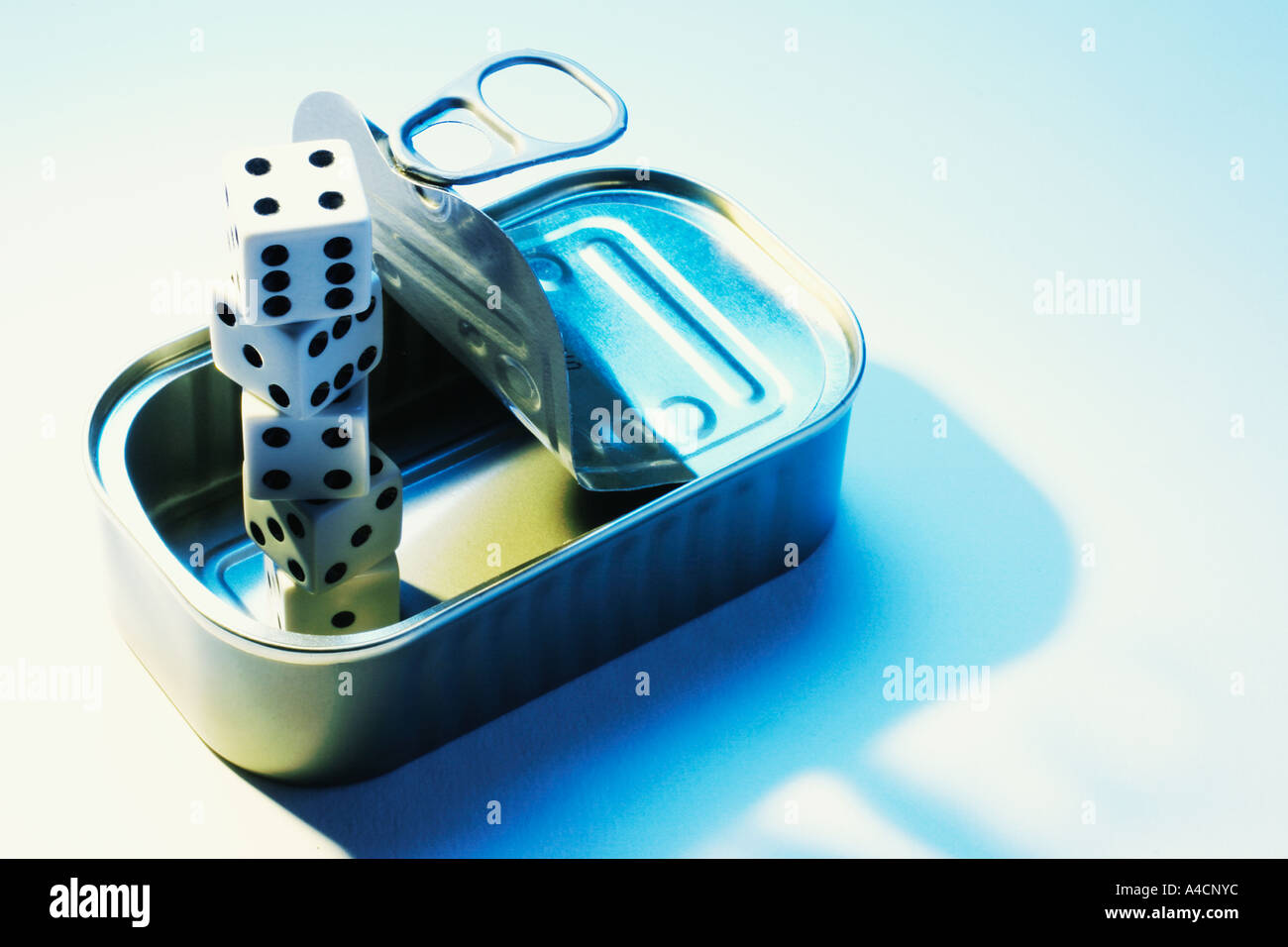 Stack of Dice in Tin Can Stock Photo - Alamy