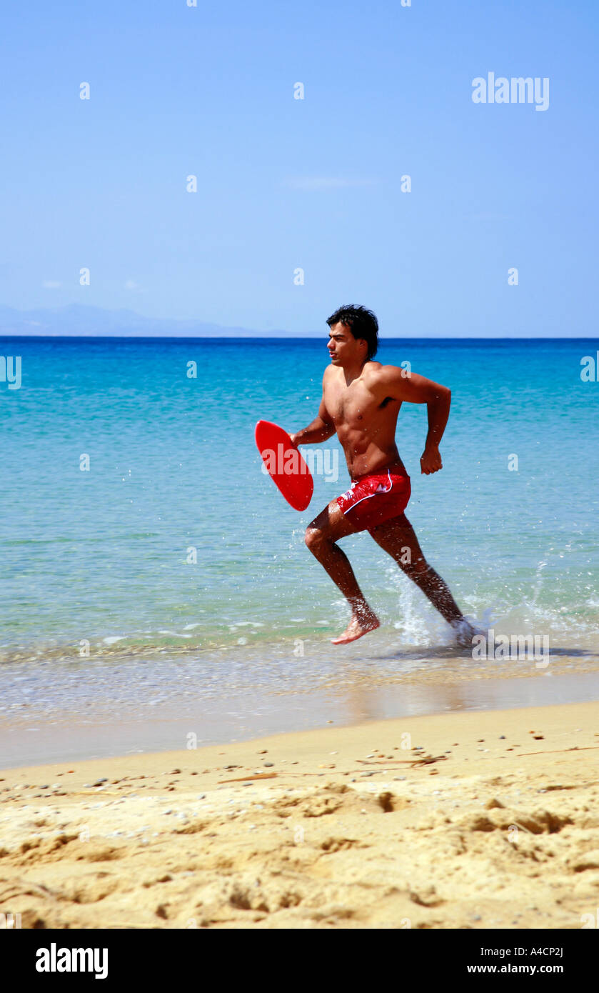 Man splashing through water Stock Photo - Alamy