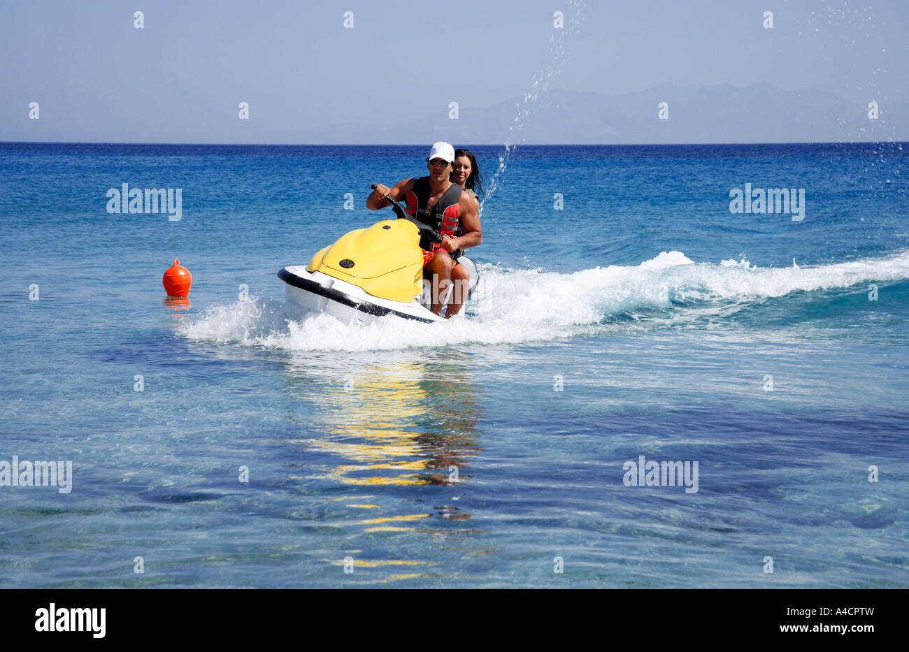 Young couple on jet ski Stock Photo - Alamy